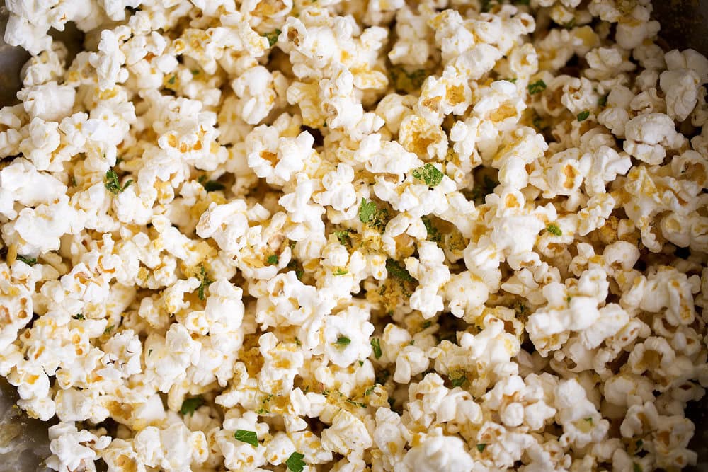 Cheesy Garlic Parmesan Popcorn - Cooking with Cocktail Rings