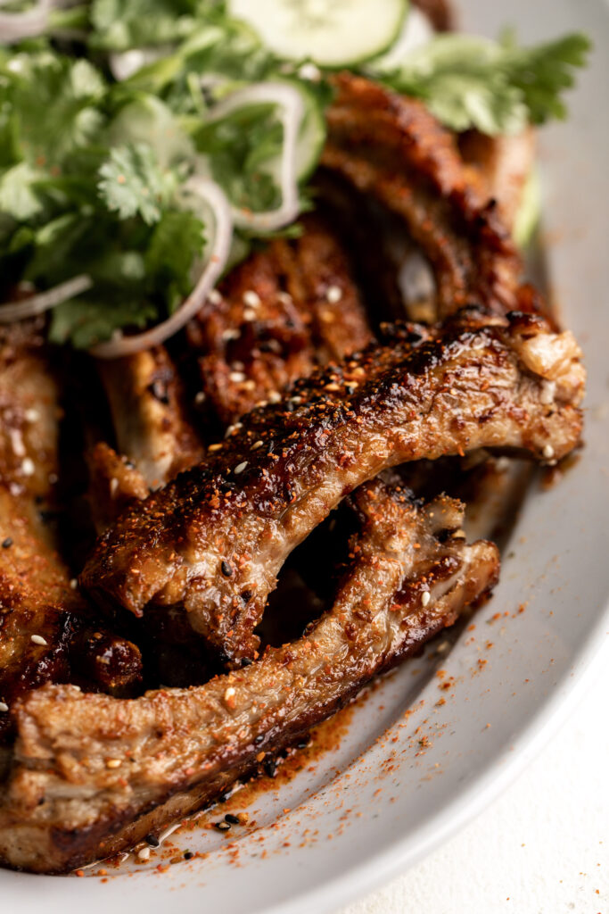 Togarashi Pork Ribs with Cucumber Herb Salad