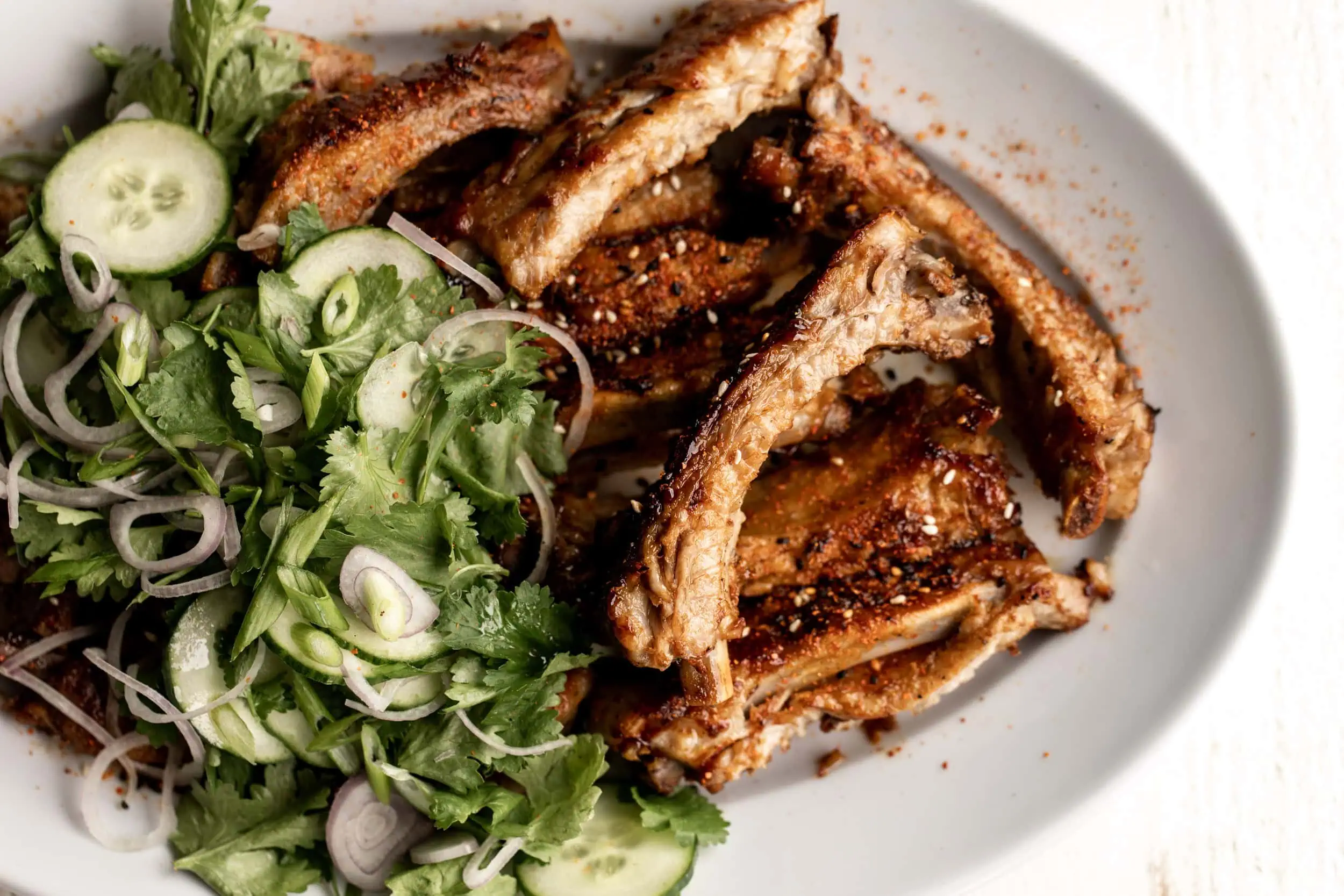 Togarashi Pork Ribs with Cucumber Herb Salad
