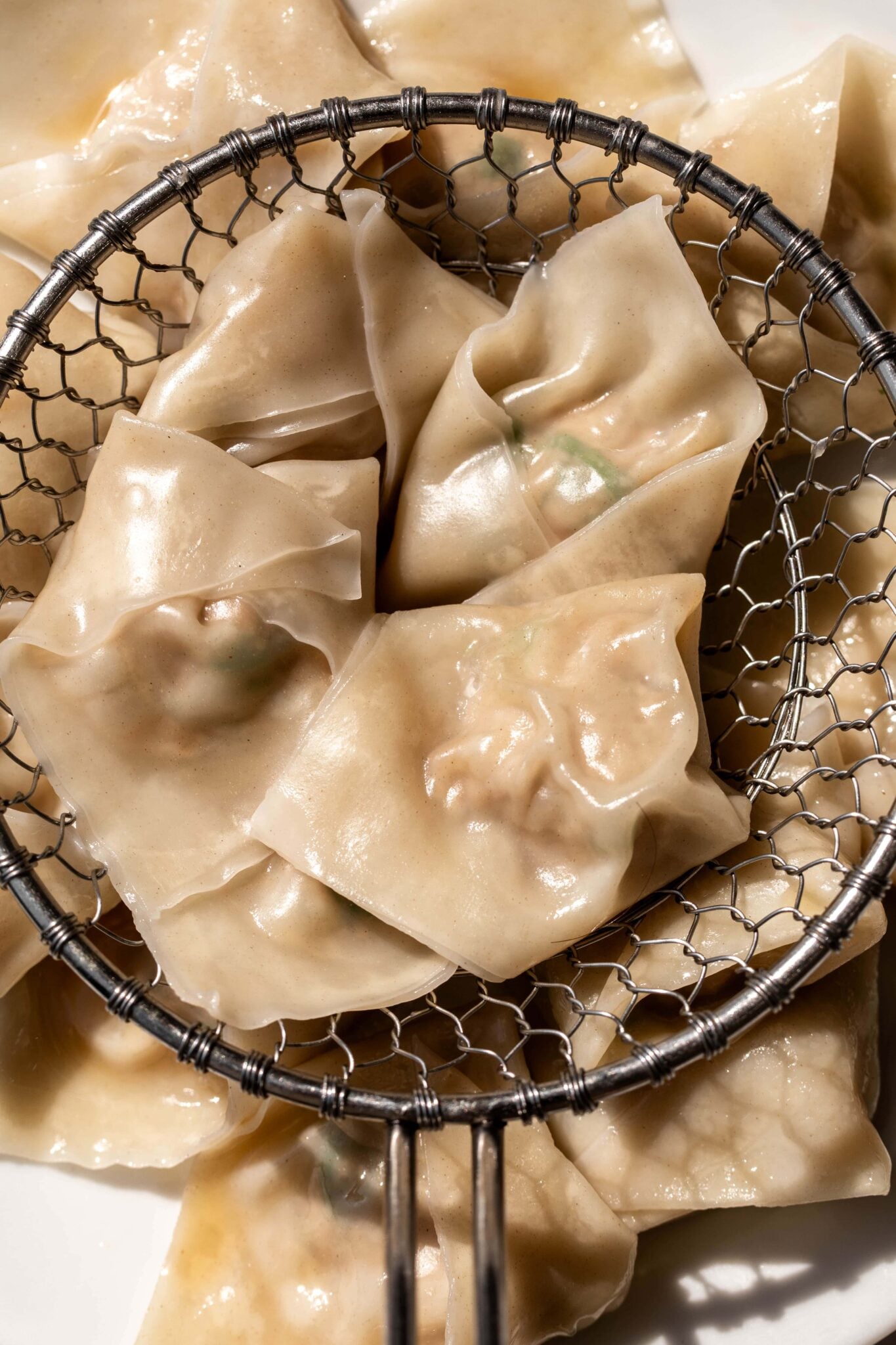 Pork Wontons with Peanut and Chili Sauce - Cooking with Cocktail Rings